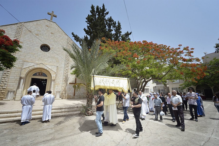 'We have nothing except our church - faith is stronger than war,' says ...