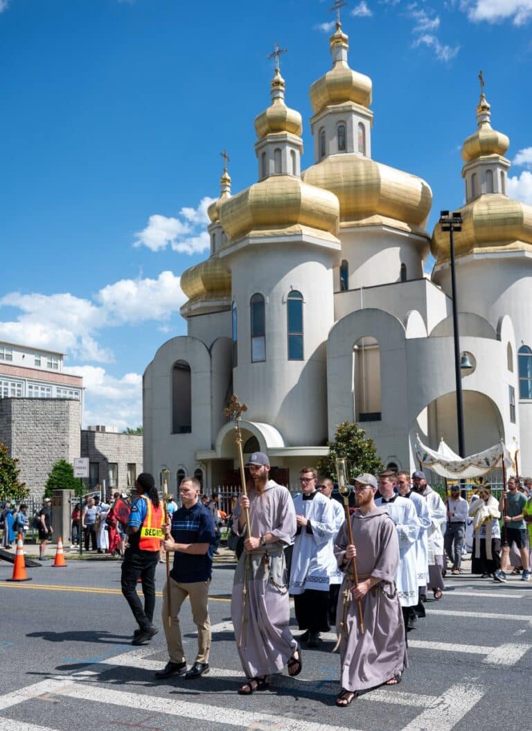 ‘He’s truly there:’ Hundreds of pilgrims process with Eucharist through ...
